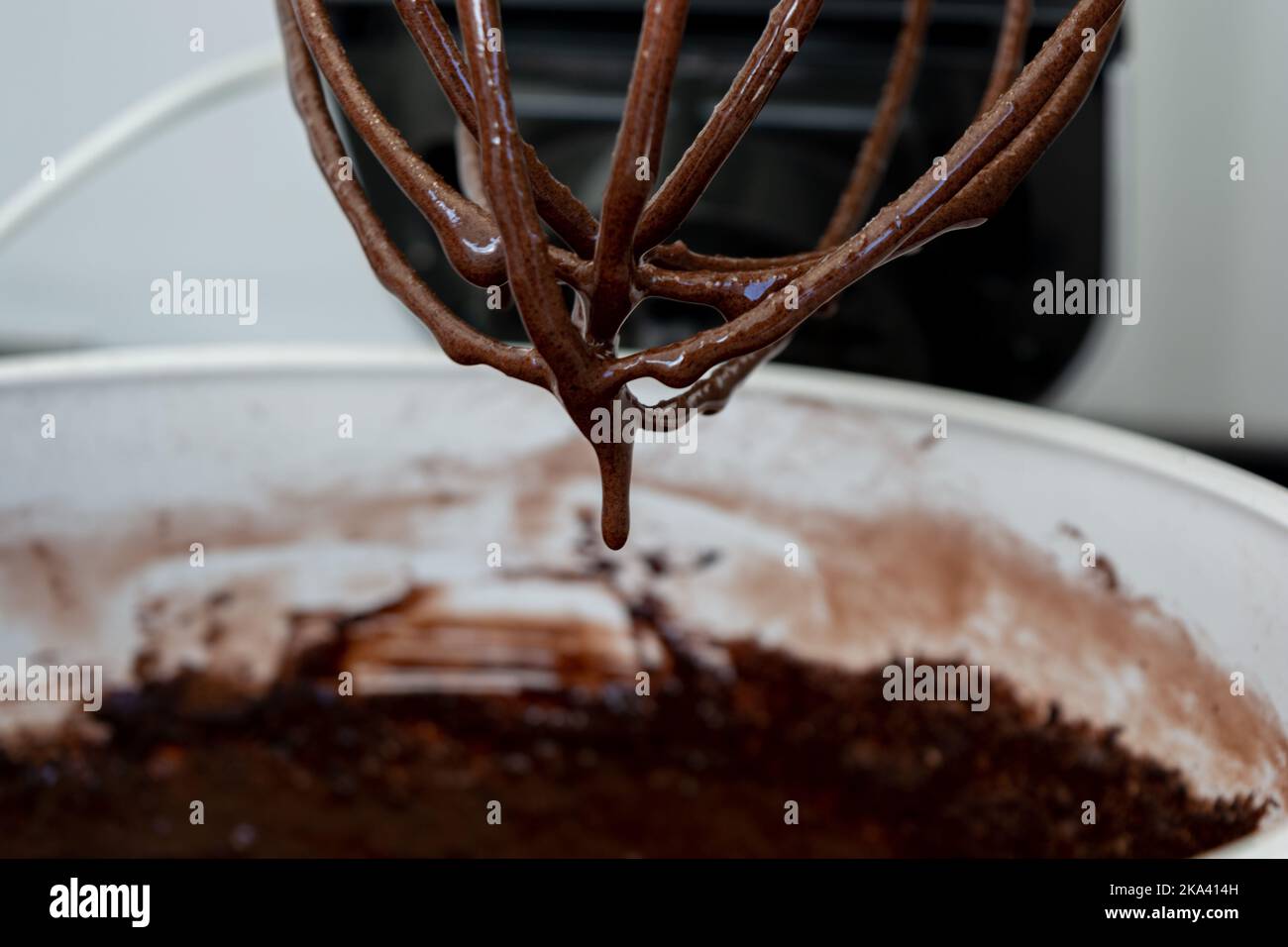A closeup shot of a kitchen mixer with dripping brownie dough Stock ...