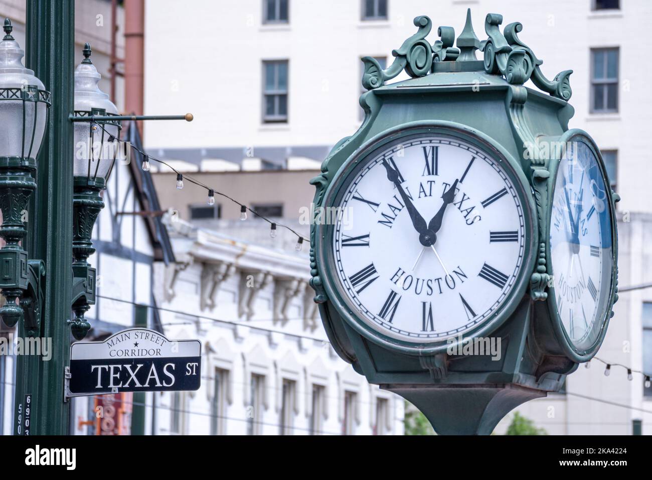 A green clock on a street in Downtown Houston, Texas Stock Photo - Alamy