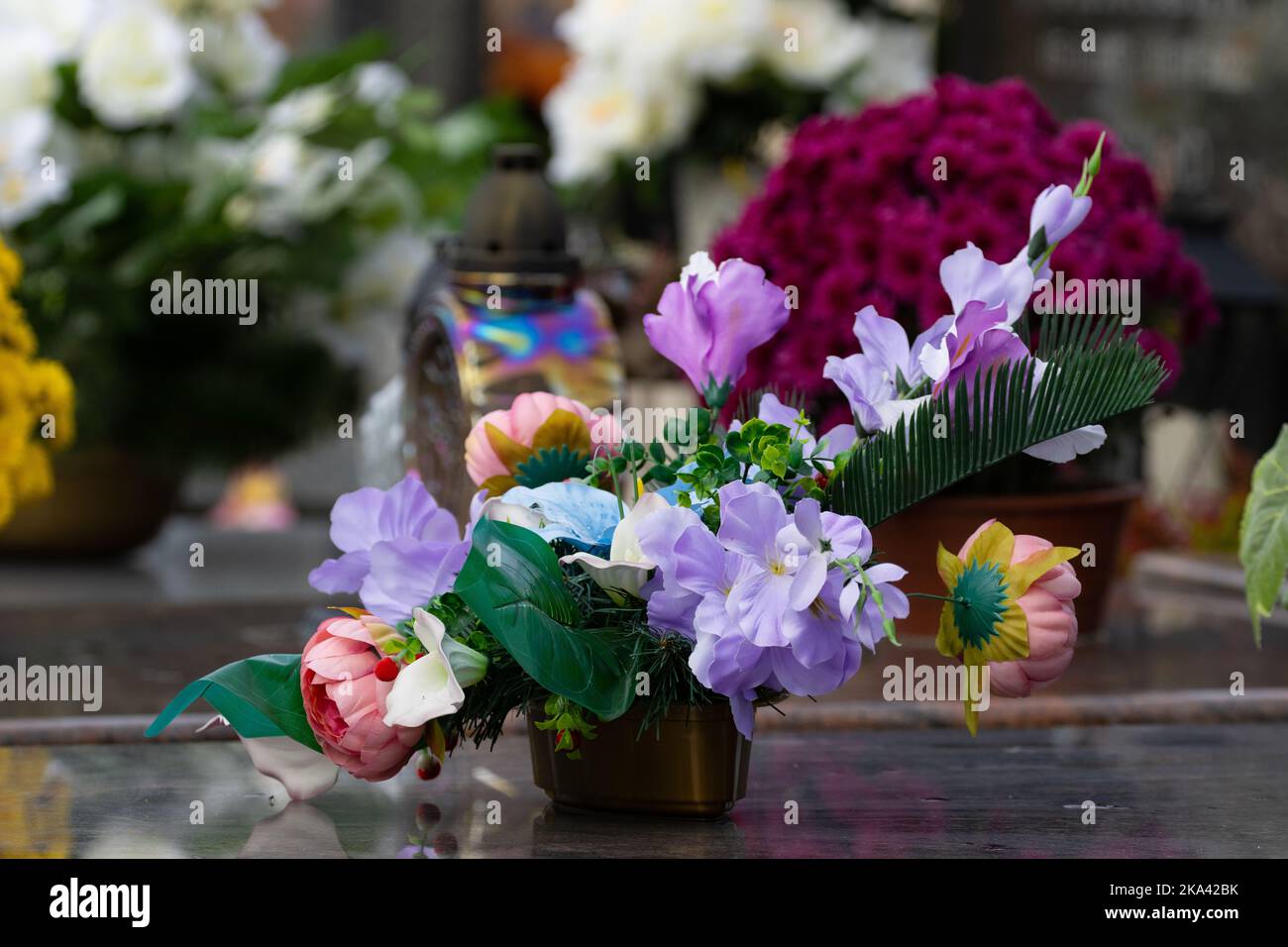 Flowers on the grave. Feast of the Dead. A bunch of flowers in the ...