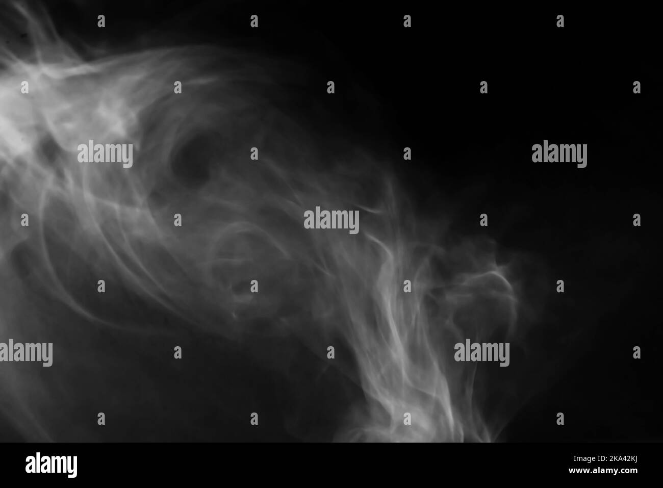 Beautiful white abstract steam from tea or coffee hot water on a black ...