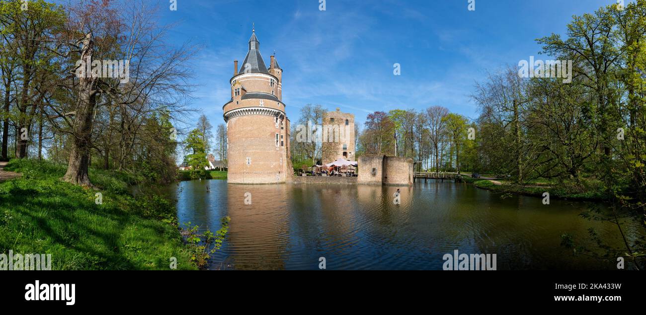 Wide panorama showing park with remains and round fairy tale tower of ...