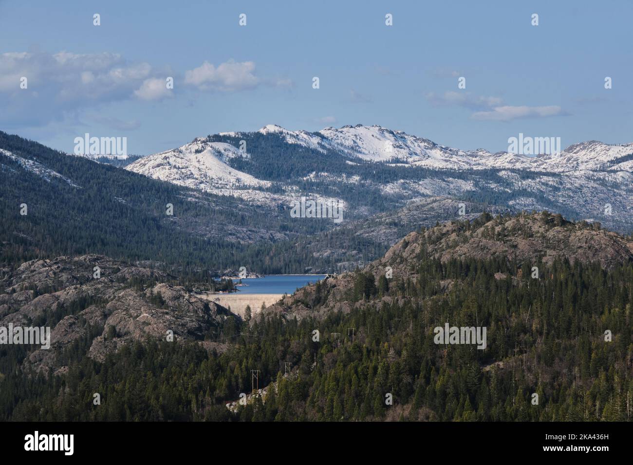 A beautiful view of a lake surrounded by trees and mountains Stock ...