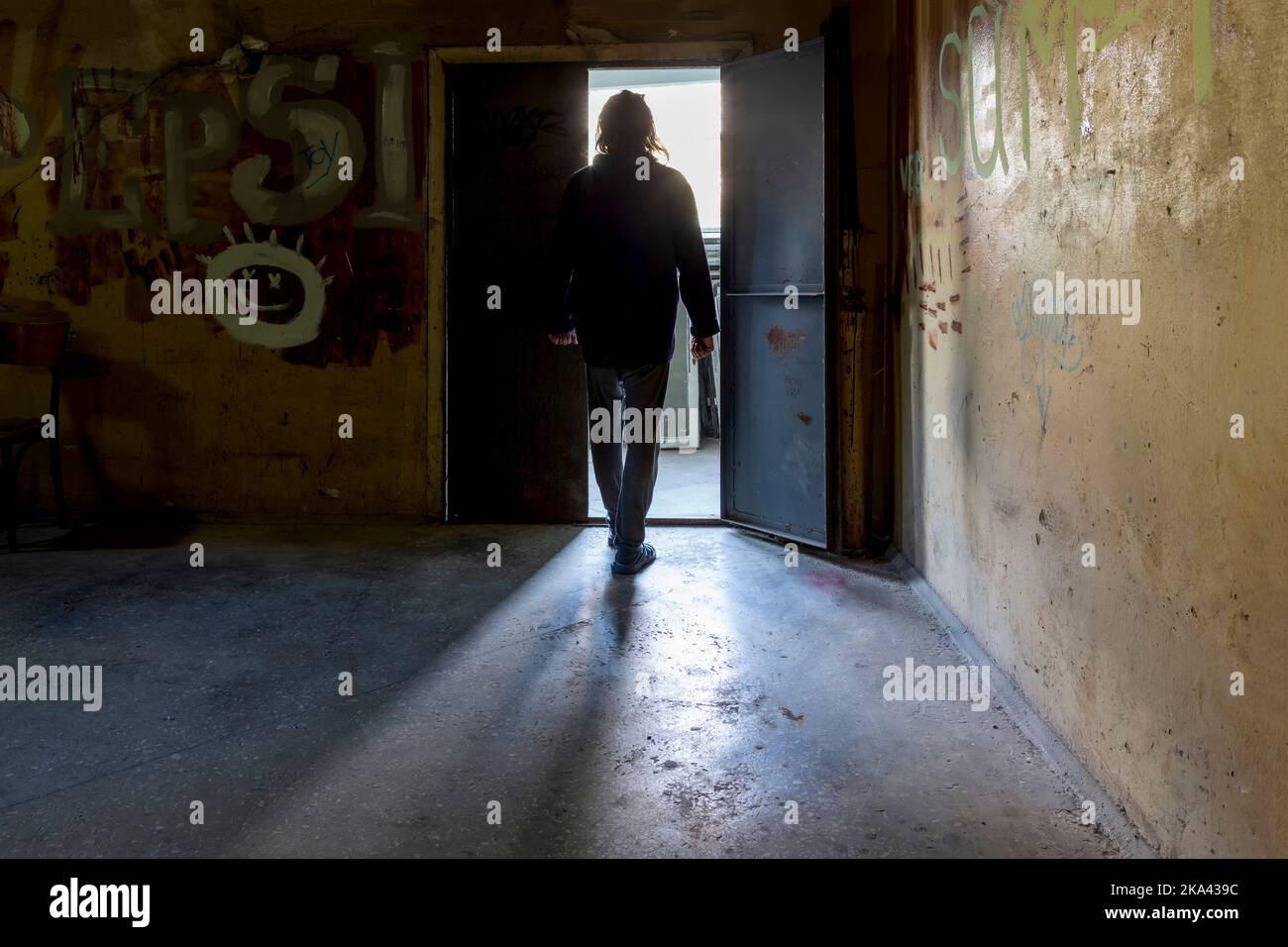 A man in an empty room in the doorway Stock Photo - Alamy