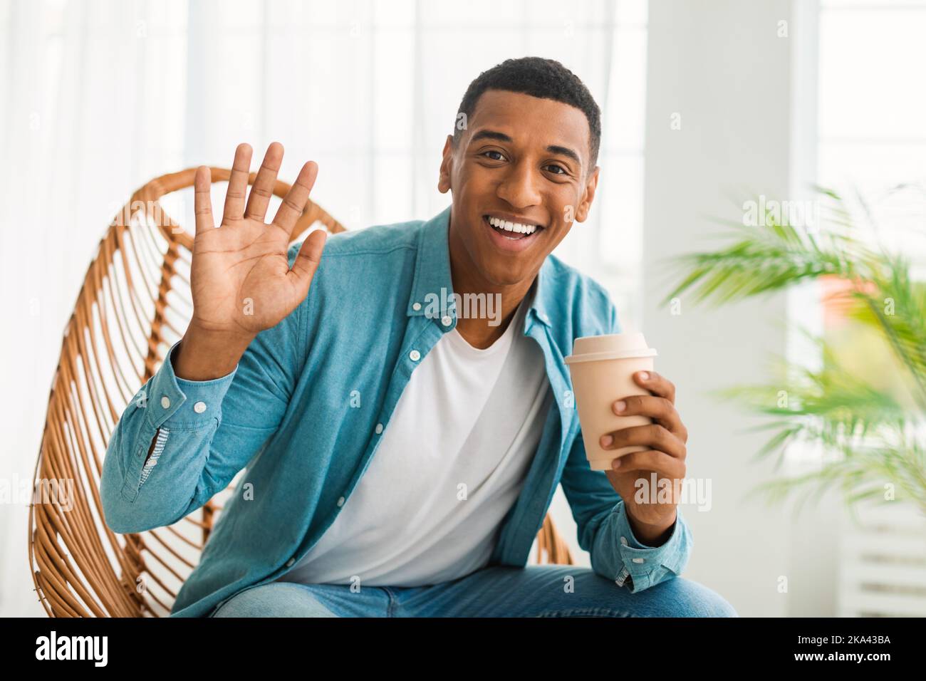 Happy millennial african american man with cup of coffee takeaway and ...