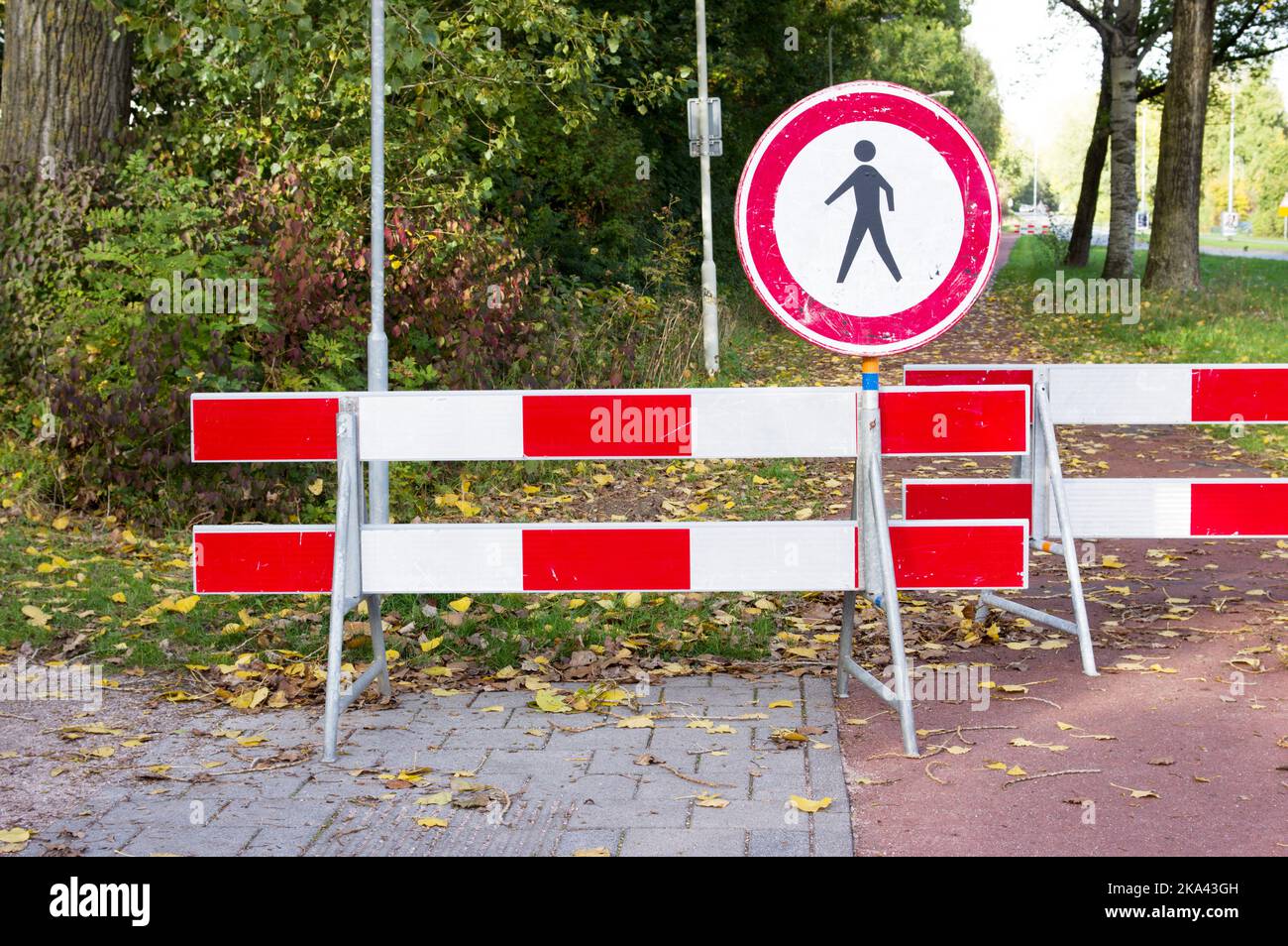 Road closed with barriers and sign for pedestrians for roadworks Stock ...