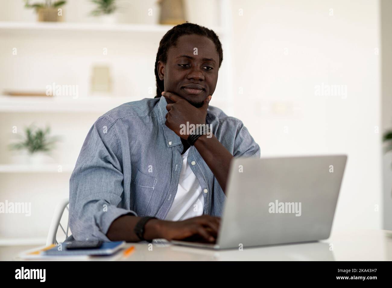 Home office browsing internet remote hi-res stock photography and ...