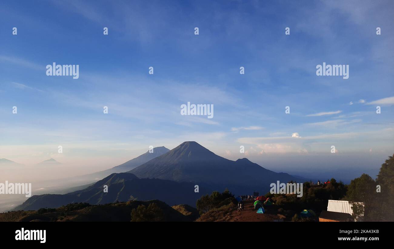 A beautiful shot of mountain layers under a cloudy sky Stock Photo - Alamy