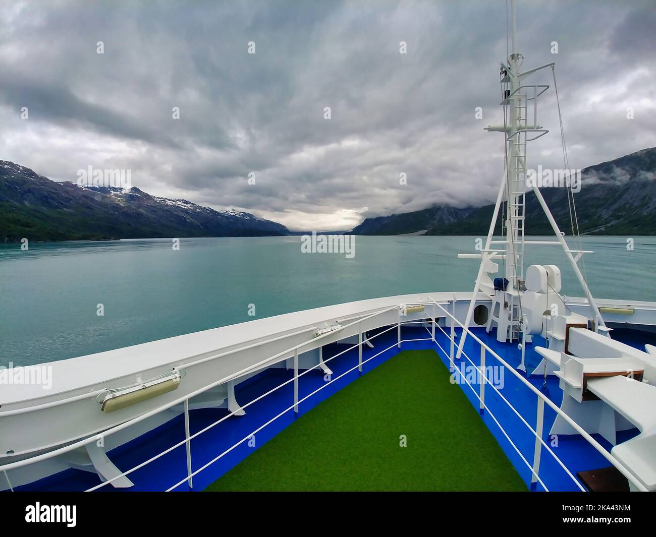 cruise ship front desk sailing the alaskan mountains fjord Stock Photo ...