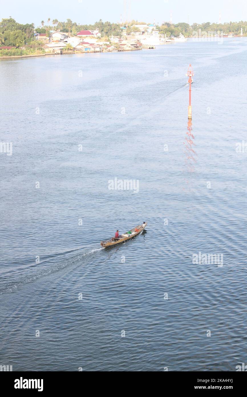 A beautiful view of a fishing boat in a lake on a sunny day Stock Photo ...