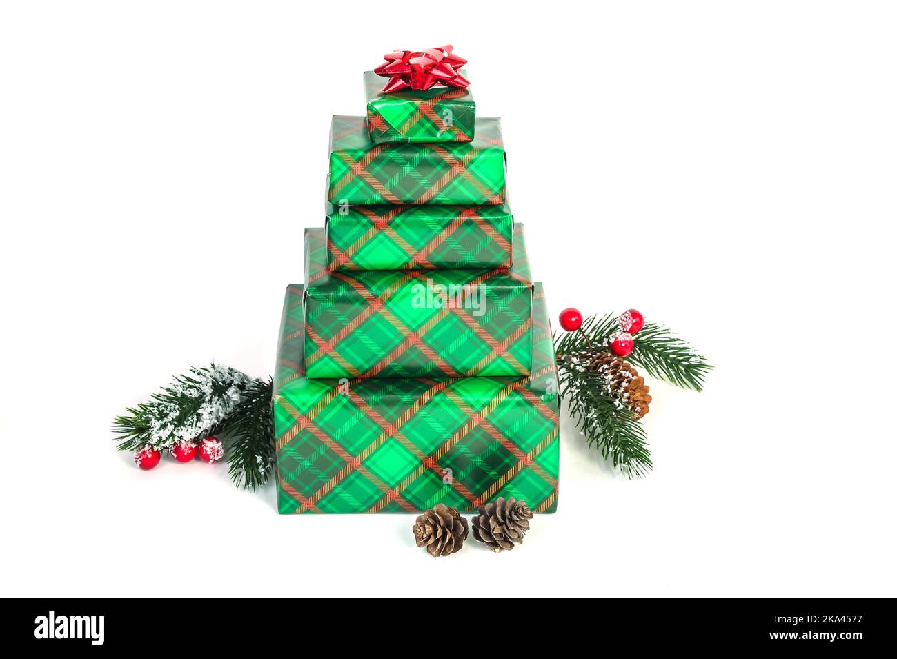 A pile of Christmas gifts in green checkered paper in the form of a ...