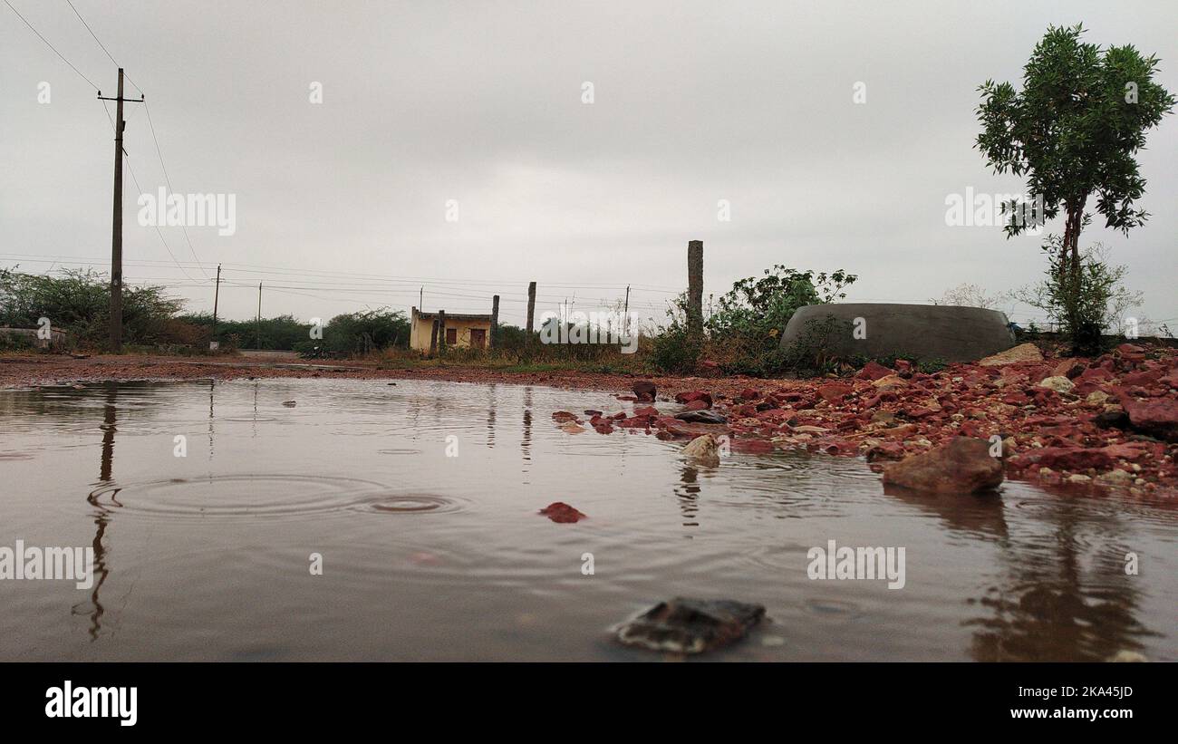 A view of a large puddle formed by rain Stock Photo - Alamy