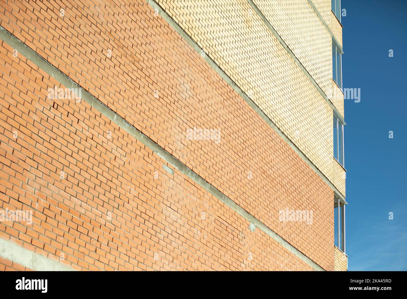 Building is made of brick. New building in city. Wall of house. Brick ...