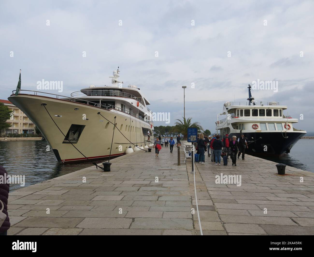 Cruise ship "Queen Eleganza" & local ferry, moored at the landing stage ...
