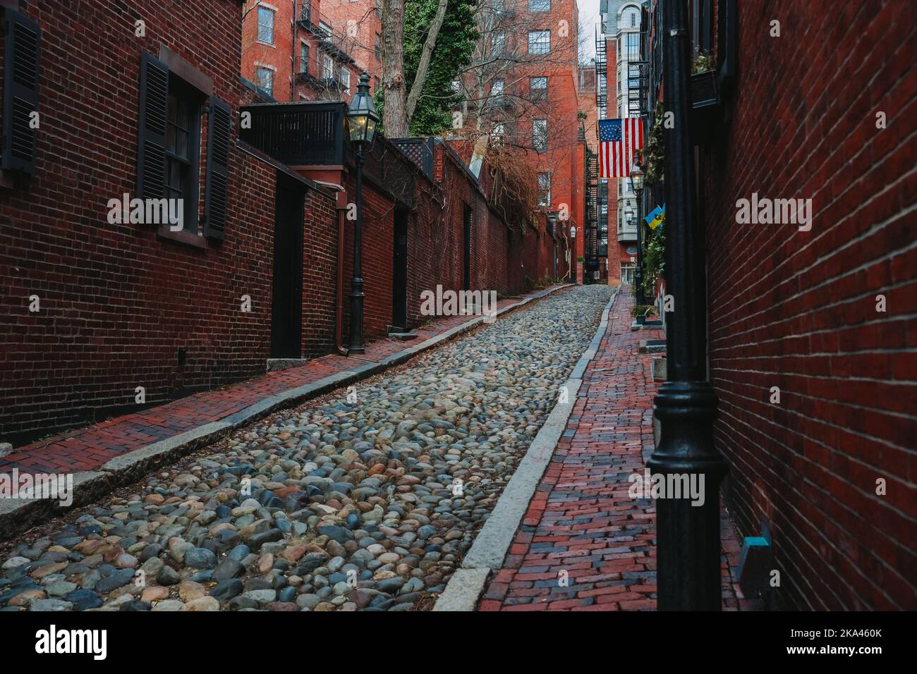 A beautiful view of a narrow pebble footpath surrounded with brick ...