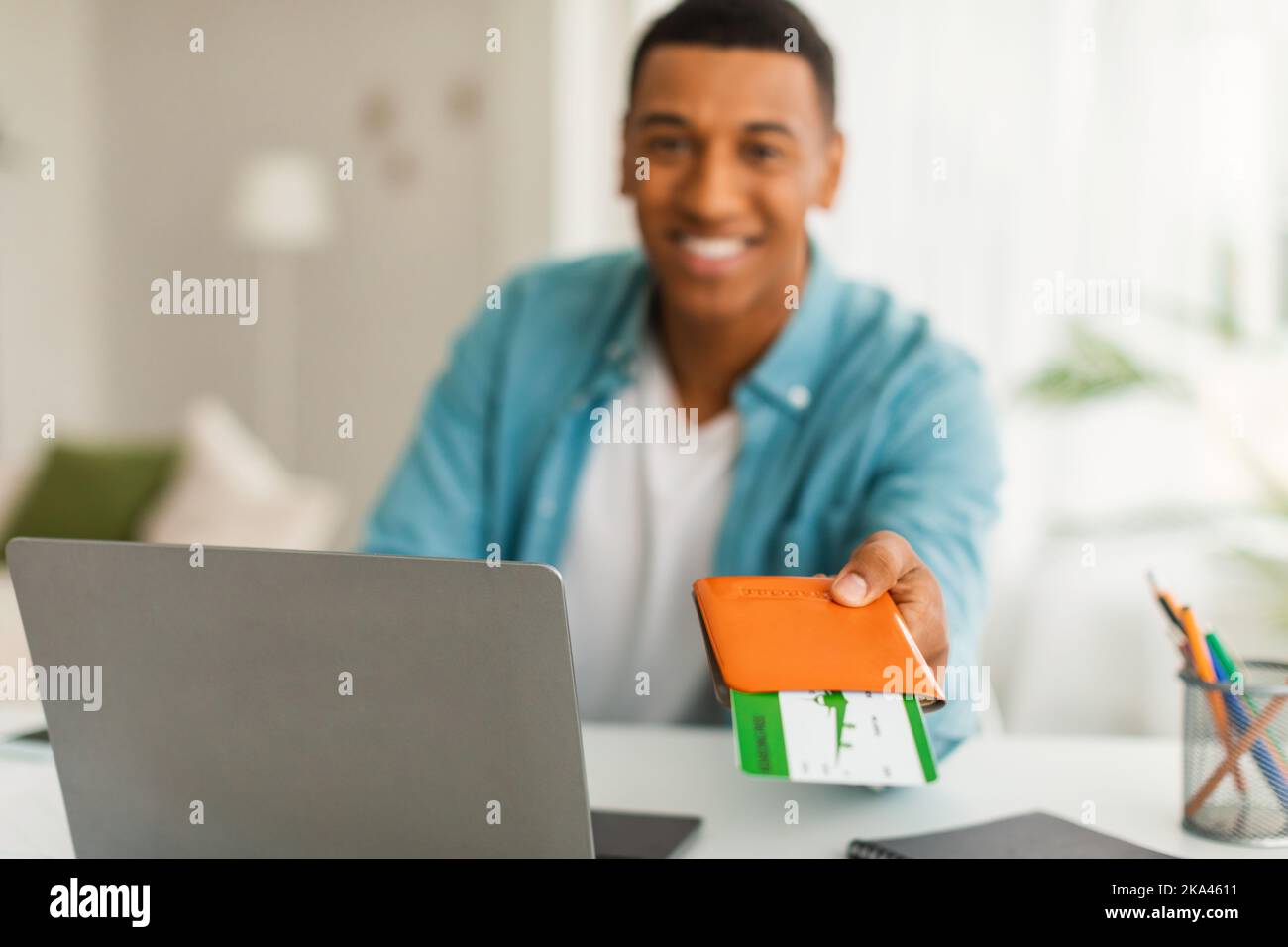 Happy millennial african american man manager with laptop giving ...