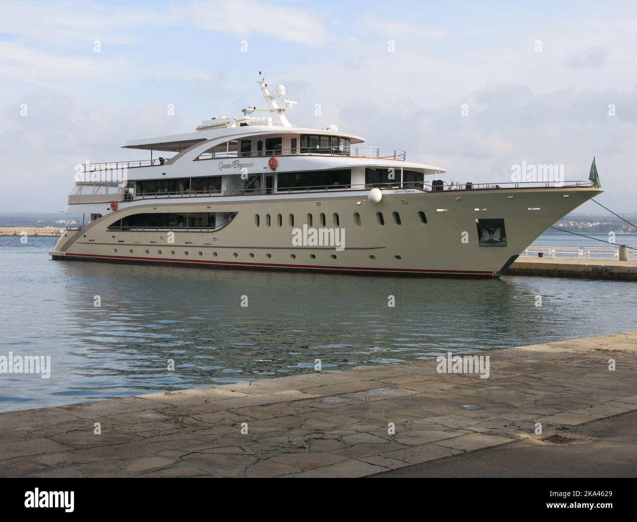 Cruise ship "Queen Eleganza" moored at the landing stage on the island ...