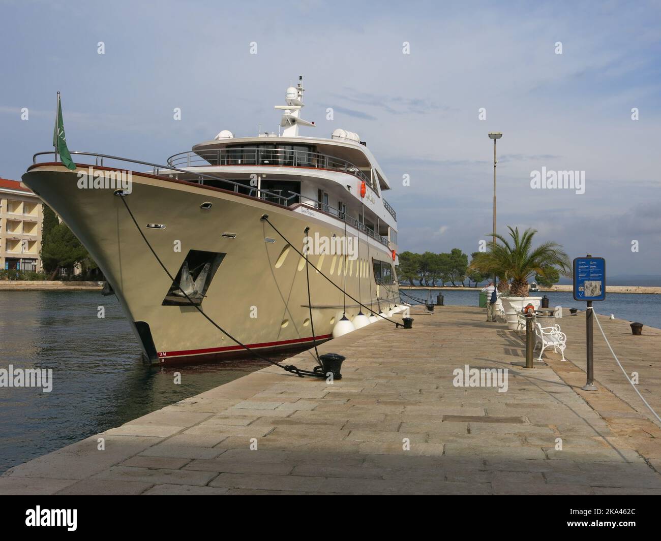 Cruise ship "Queen Eleganza" moored at the landing stage on the island ...