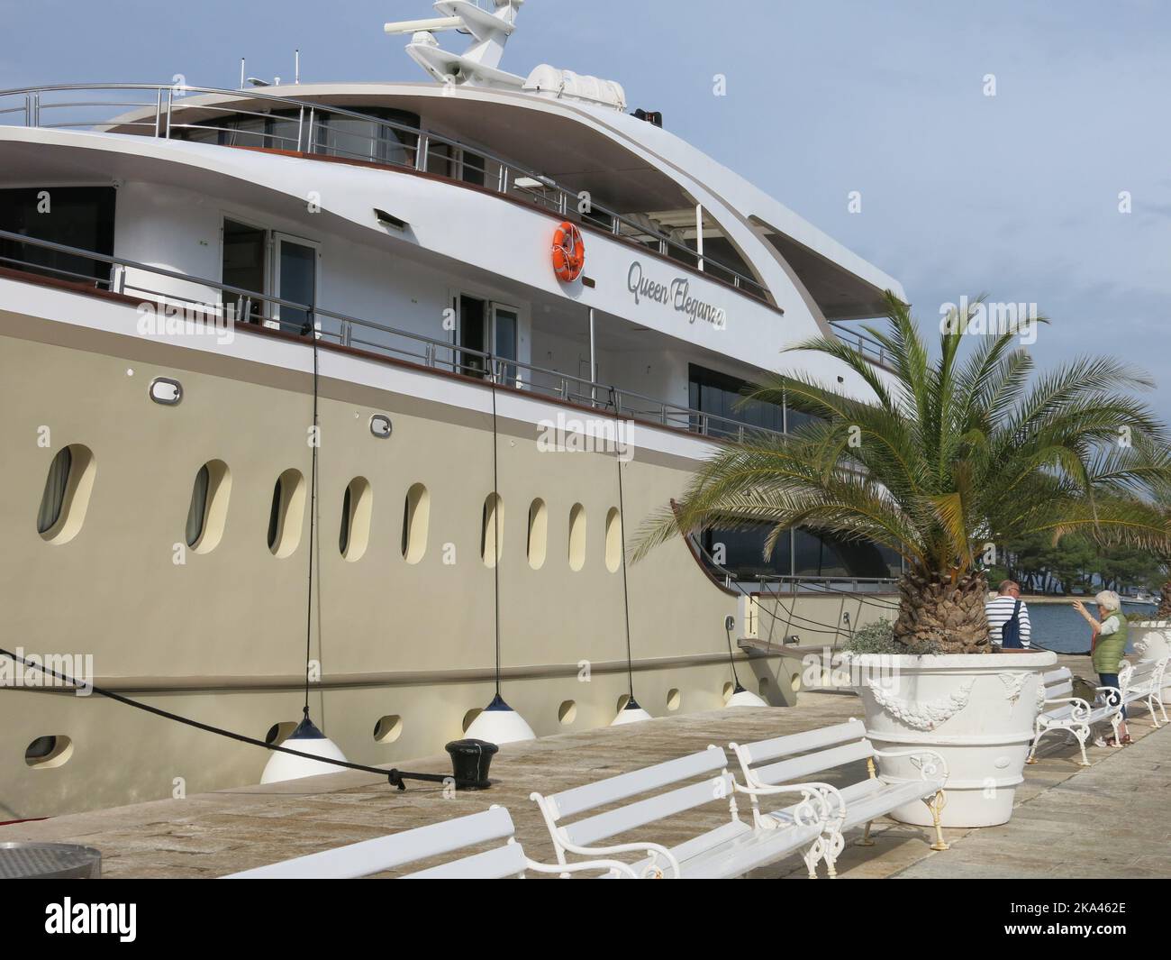 Cruise ship "Queen Eleganza" moored at the landing stage on the island ...