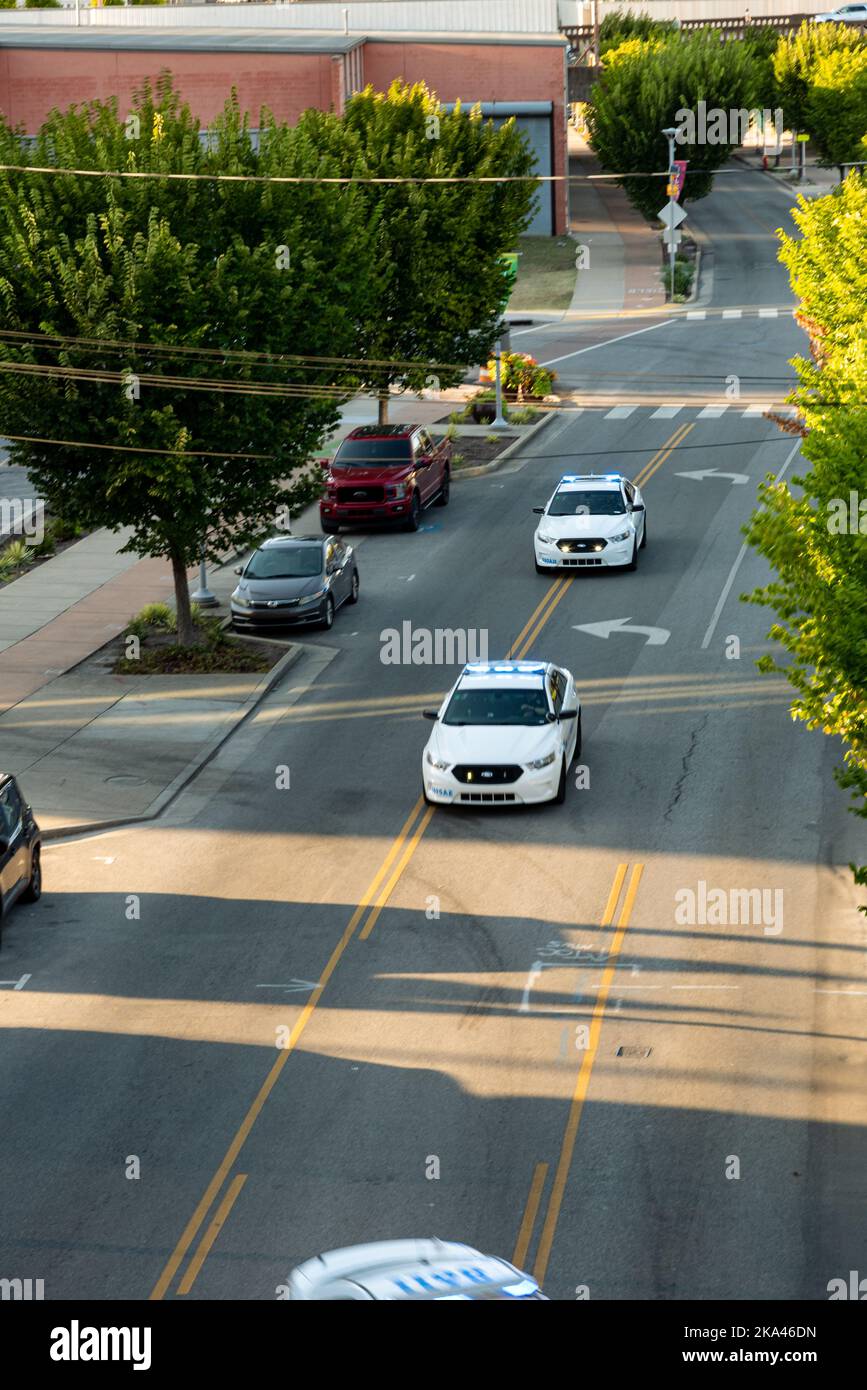 Police cars responding to a crime parked in the street in downtown ...