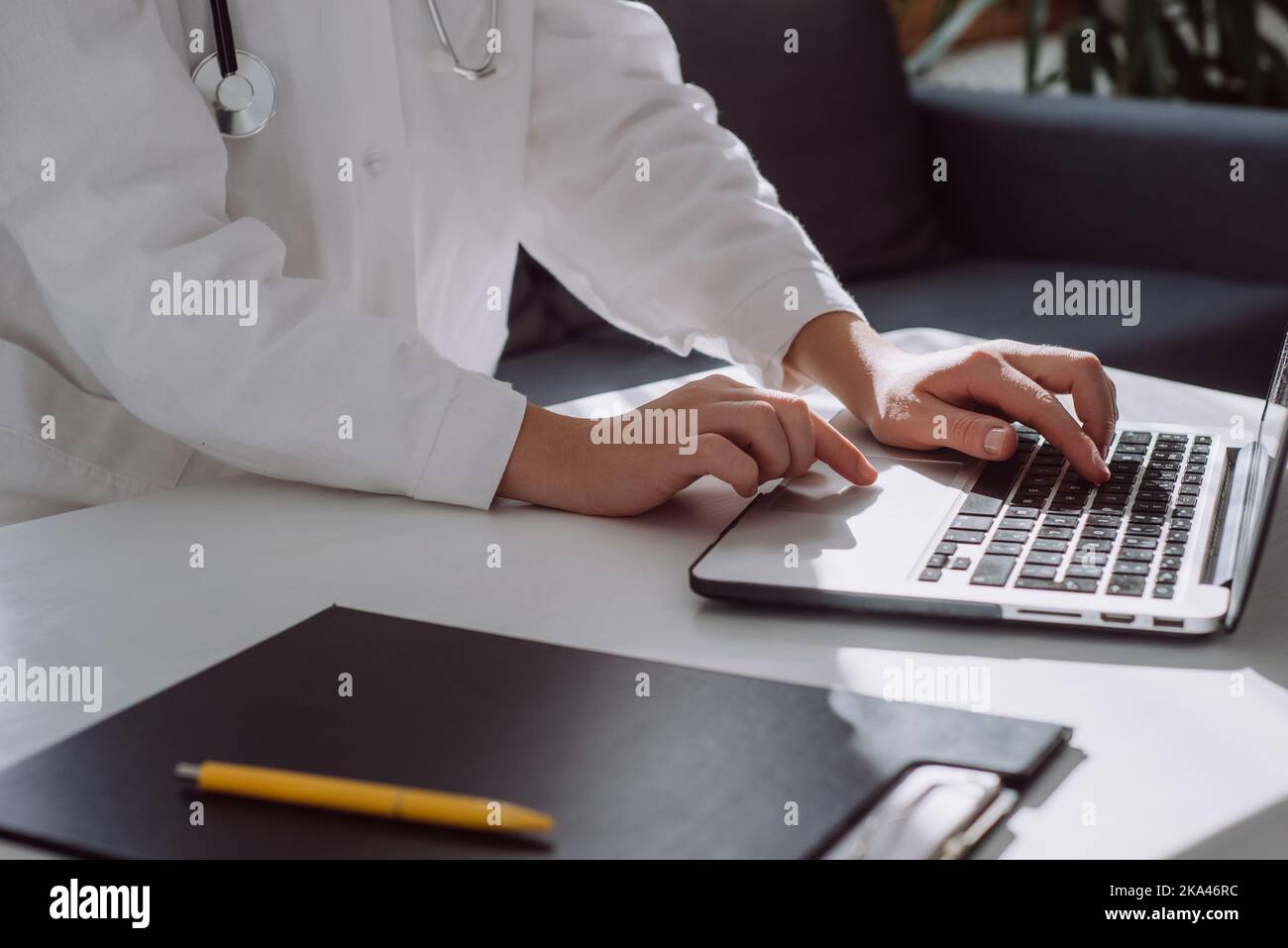 Practice nurse on computer typing hi-res stock photography and images ...
