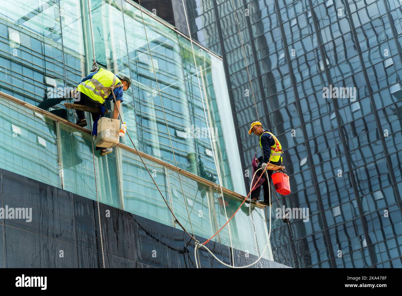 Chongqing, China-July 20th, 2021: chinese worker cleaning windows ...