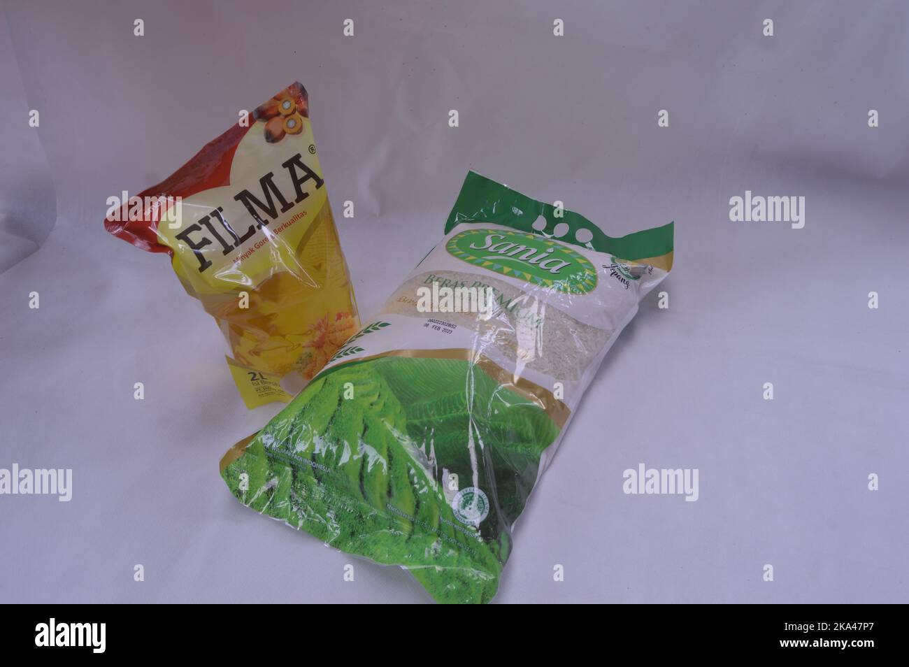Packaged rice and cooking oil on a white background Stock Photo - Alamy