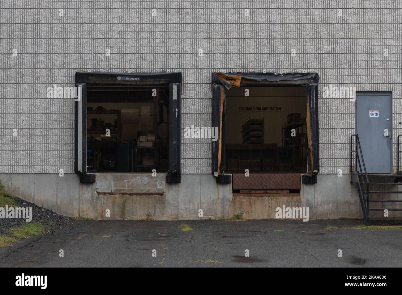 A view of the exterior of loading docks at a commercial building Stock ...