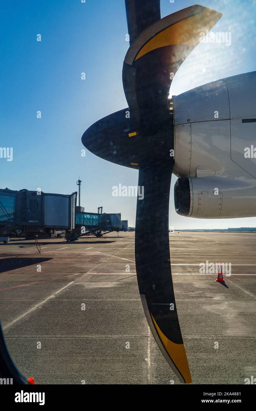 Turboprop medium-haul passenger aircraft. View from the airplane window ...