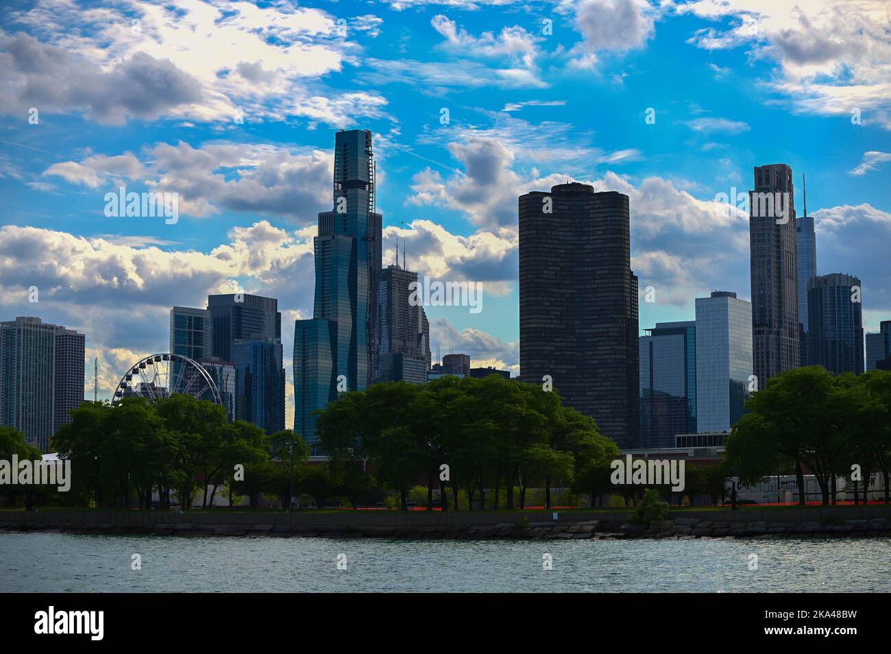 A breathtaking cityscape of modern buildings surrounded by water in ...