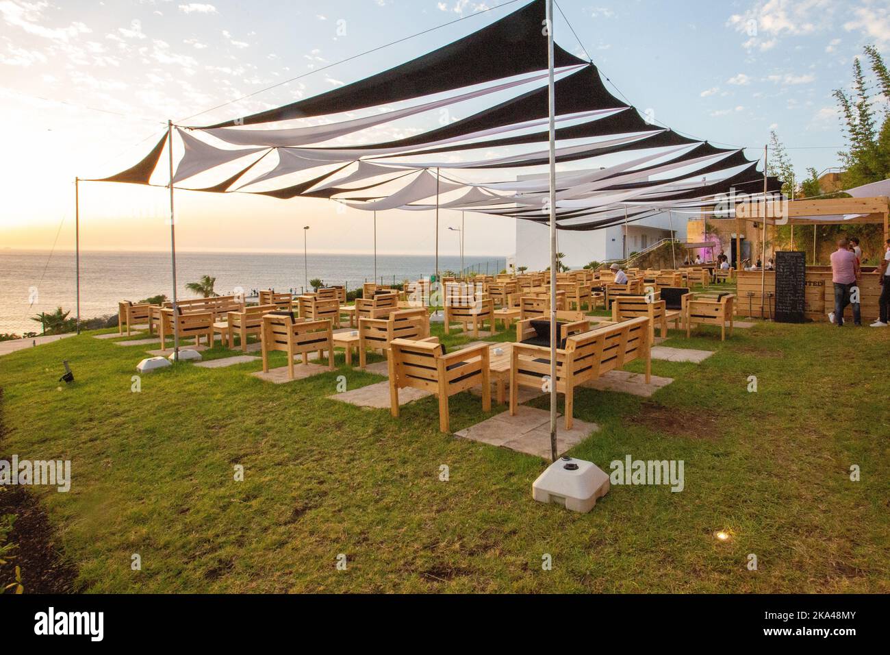 hotel patio terrace with wooden furniture Stock Photo - Alamy
