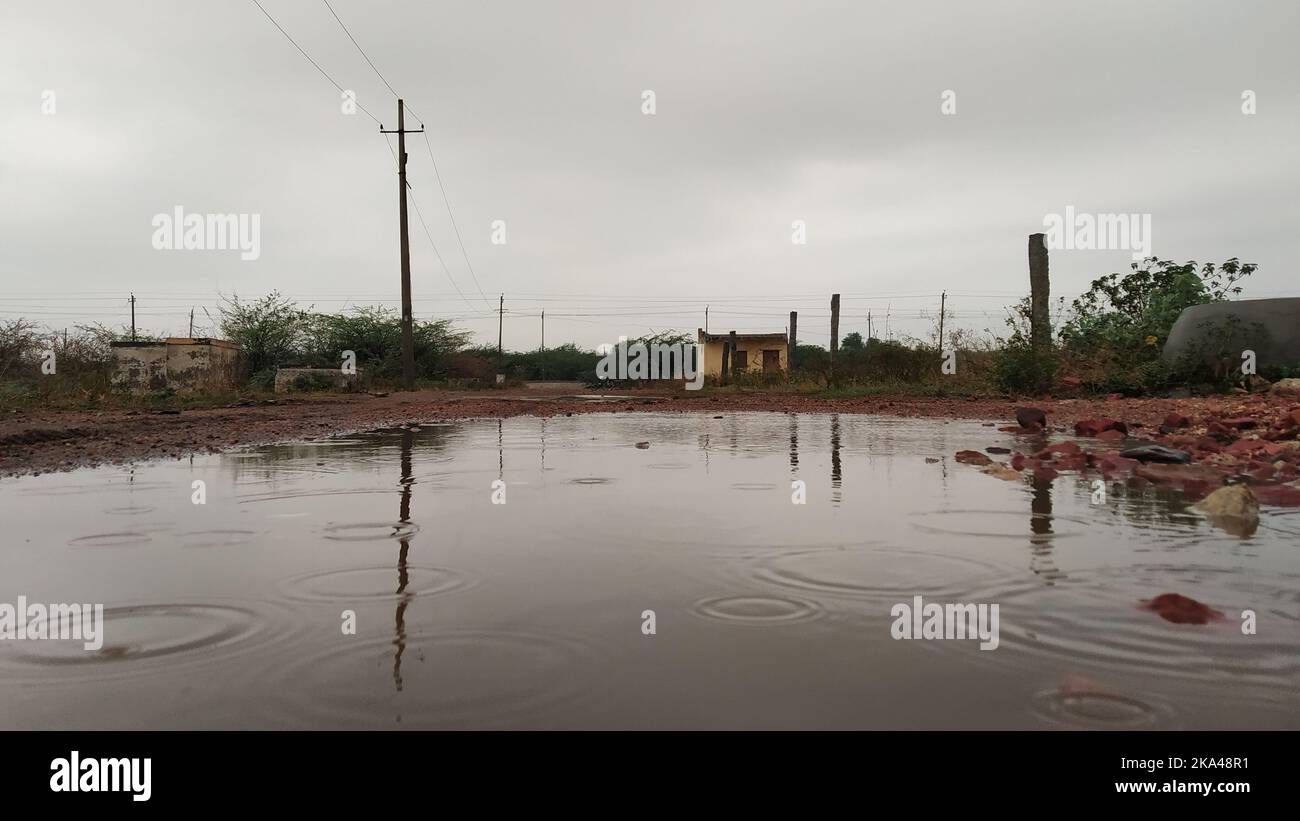 A view of a large puddle formed by rain Stock Photo - Alamy