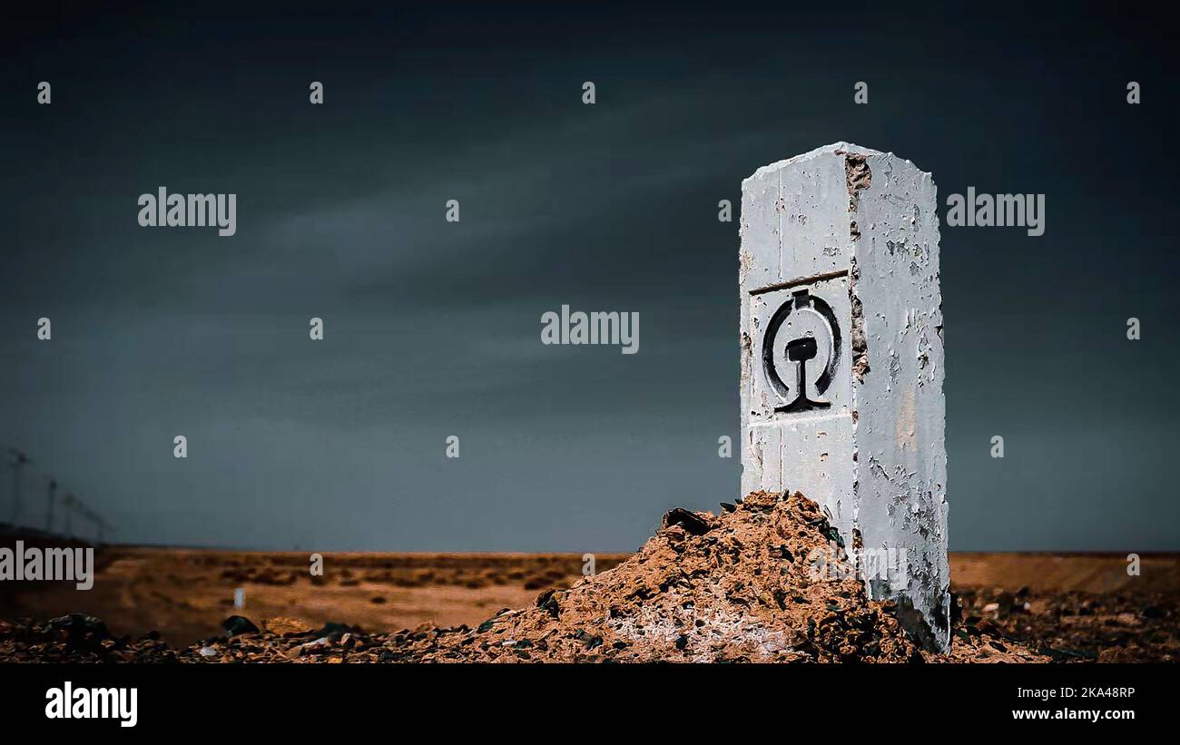 A view of a white painted statue or a memorial in an empty wild area in ...