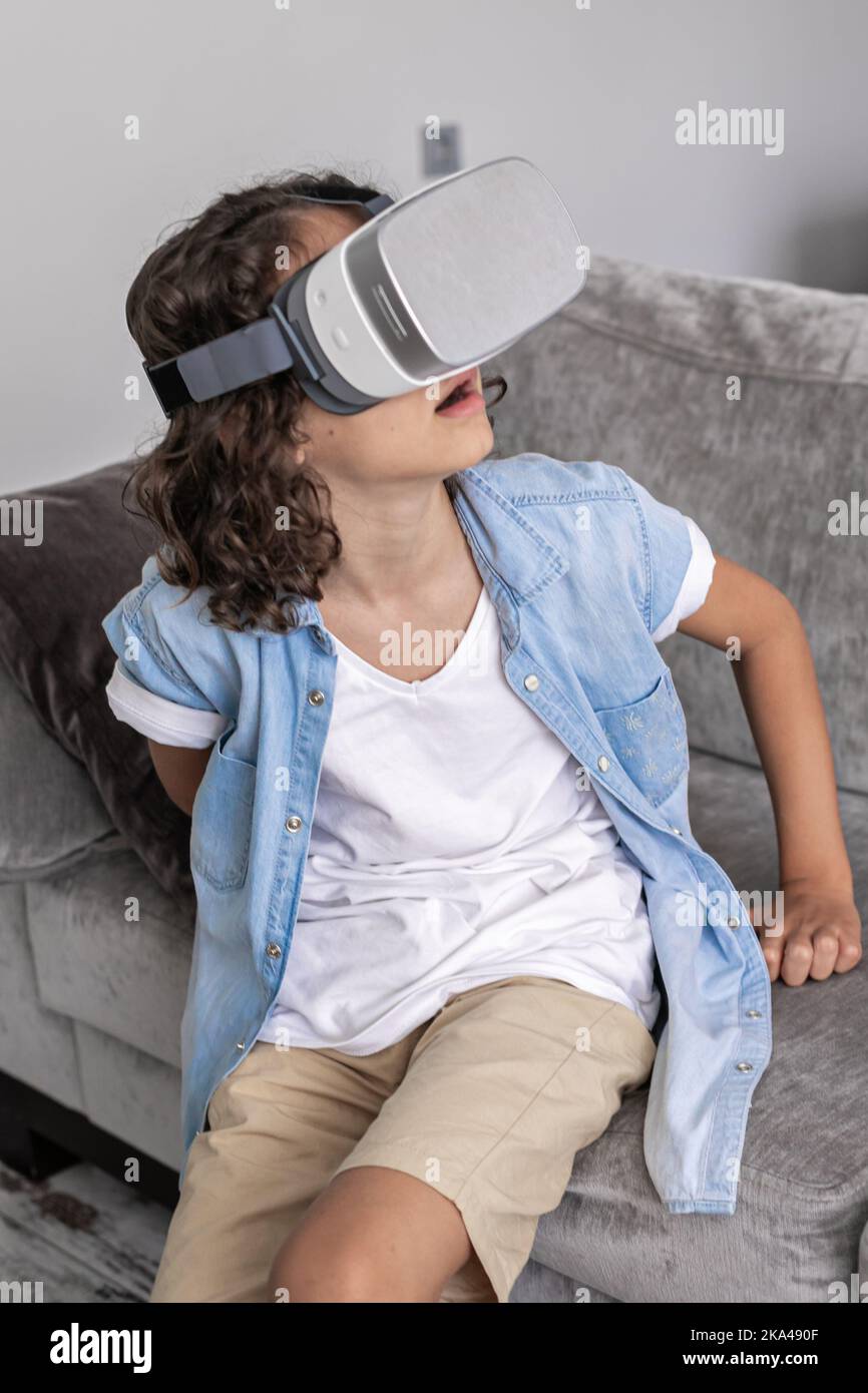 happy little boy child using virtual reality headset vr glasses ...