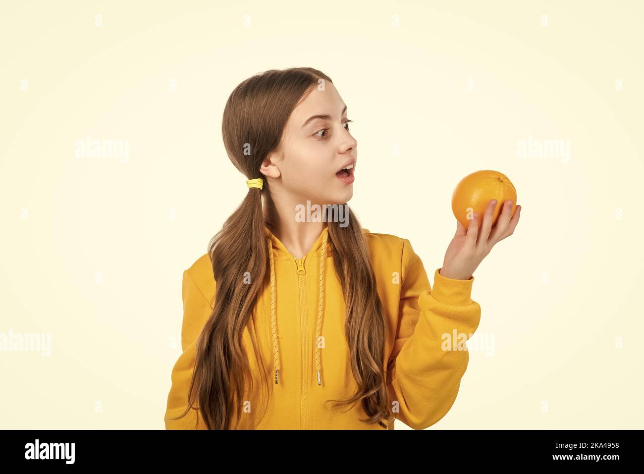 diet and kid skin beauty. amazed teen girl with orange citrus fruit ...