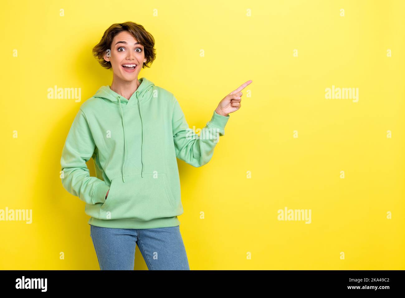 Photo portrait of pretty young girl excited point empty space ...