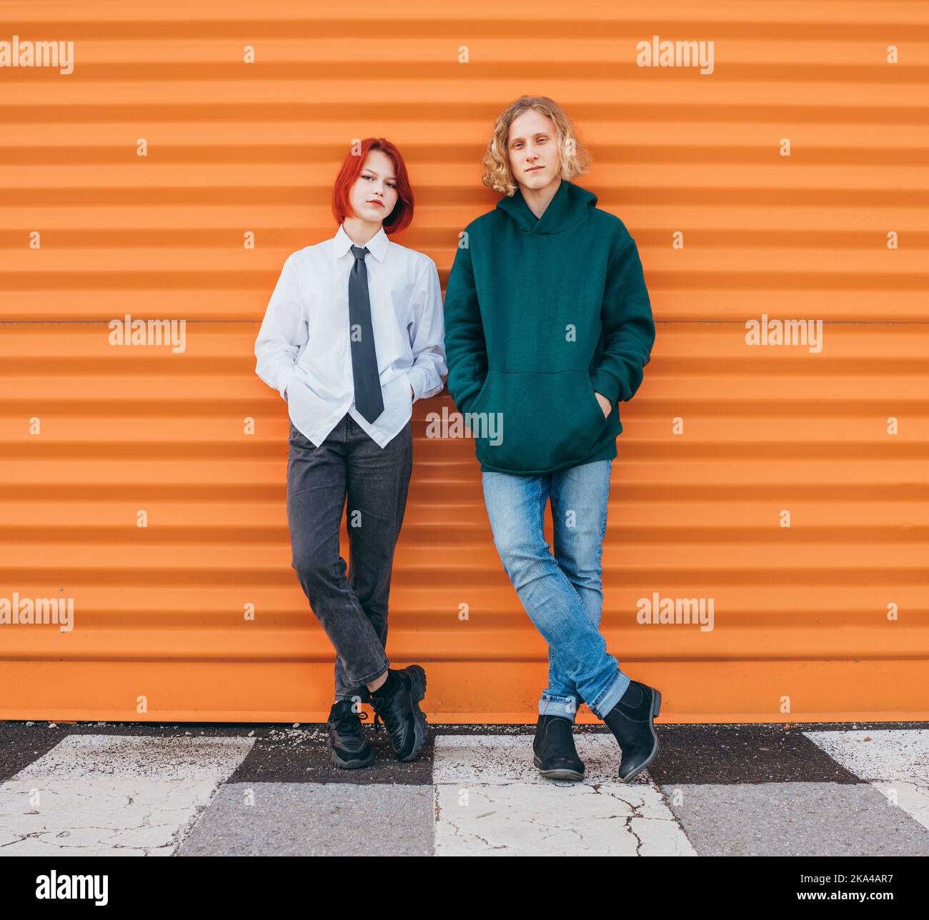 Portraits of two caucasian teen friends boy and girl posing for photo ...