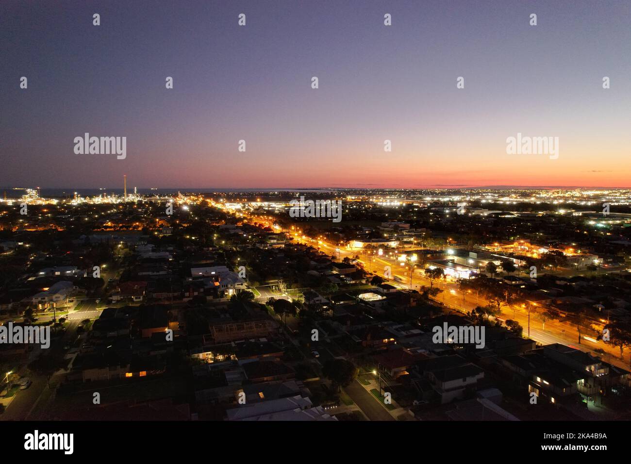 An aerial view of a sunset over a beautiful city with illuminated ...