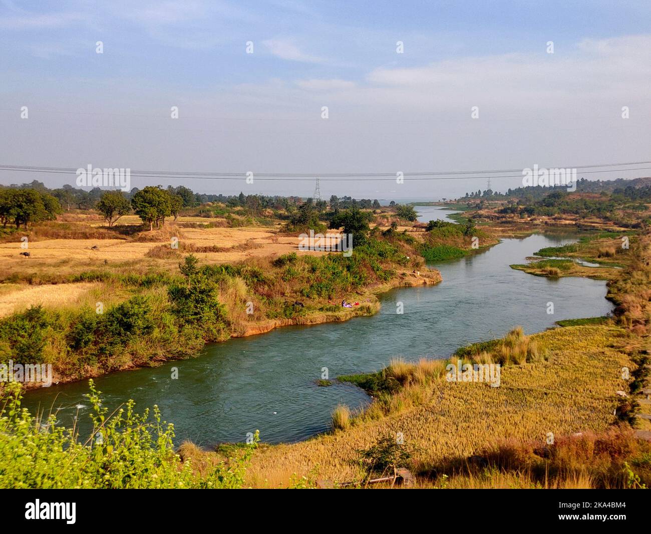 A high angle shot of a river in between dry fields Stock Photo - Alamy