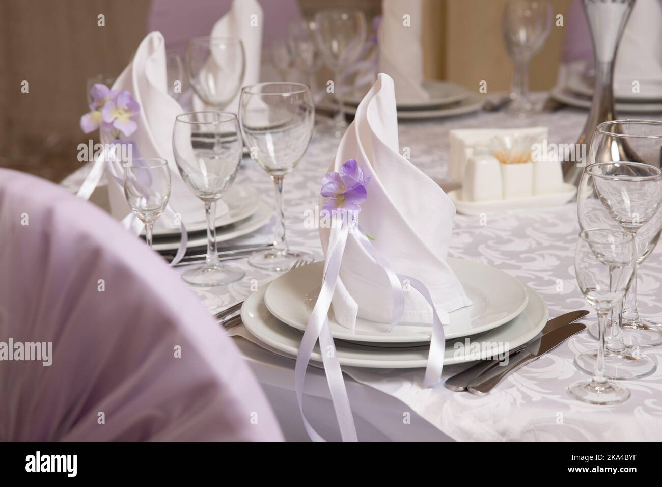 A closeup shot of the plates and glasses on a wedding table Stock Photo ...