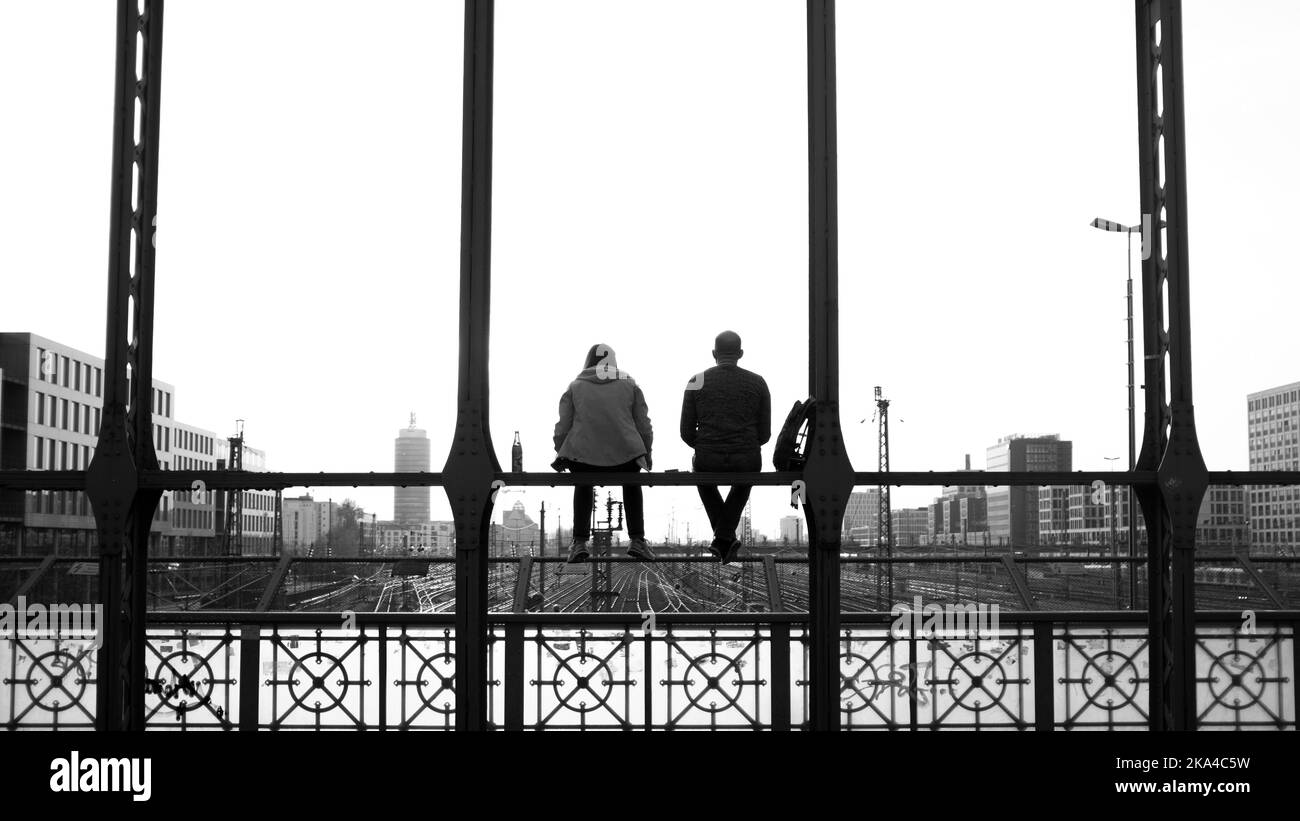 Two people resting on Black and White Stock Photos & Images - Alamy