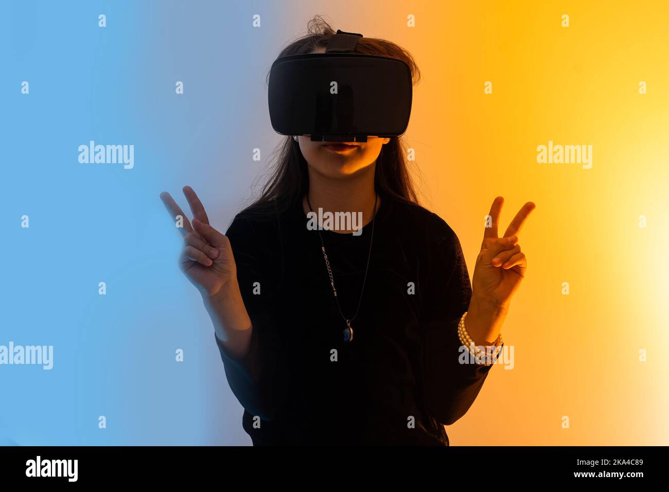 amazed teen girl wear vr glasses using technology for education in ...