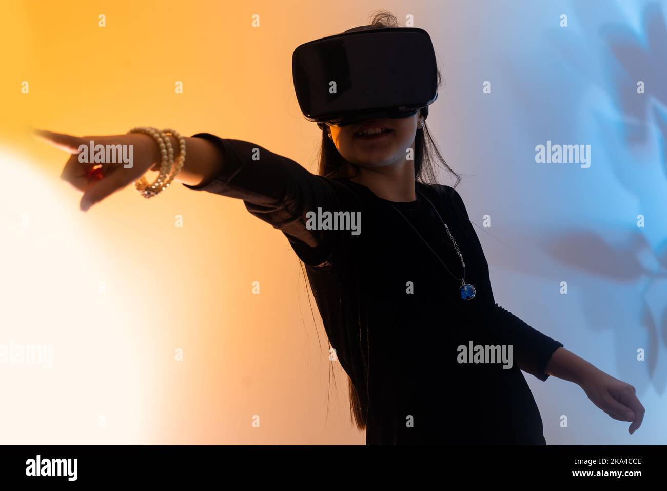 Teenage girls are having fun playing VR glasses virtual reality ...