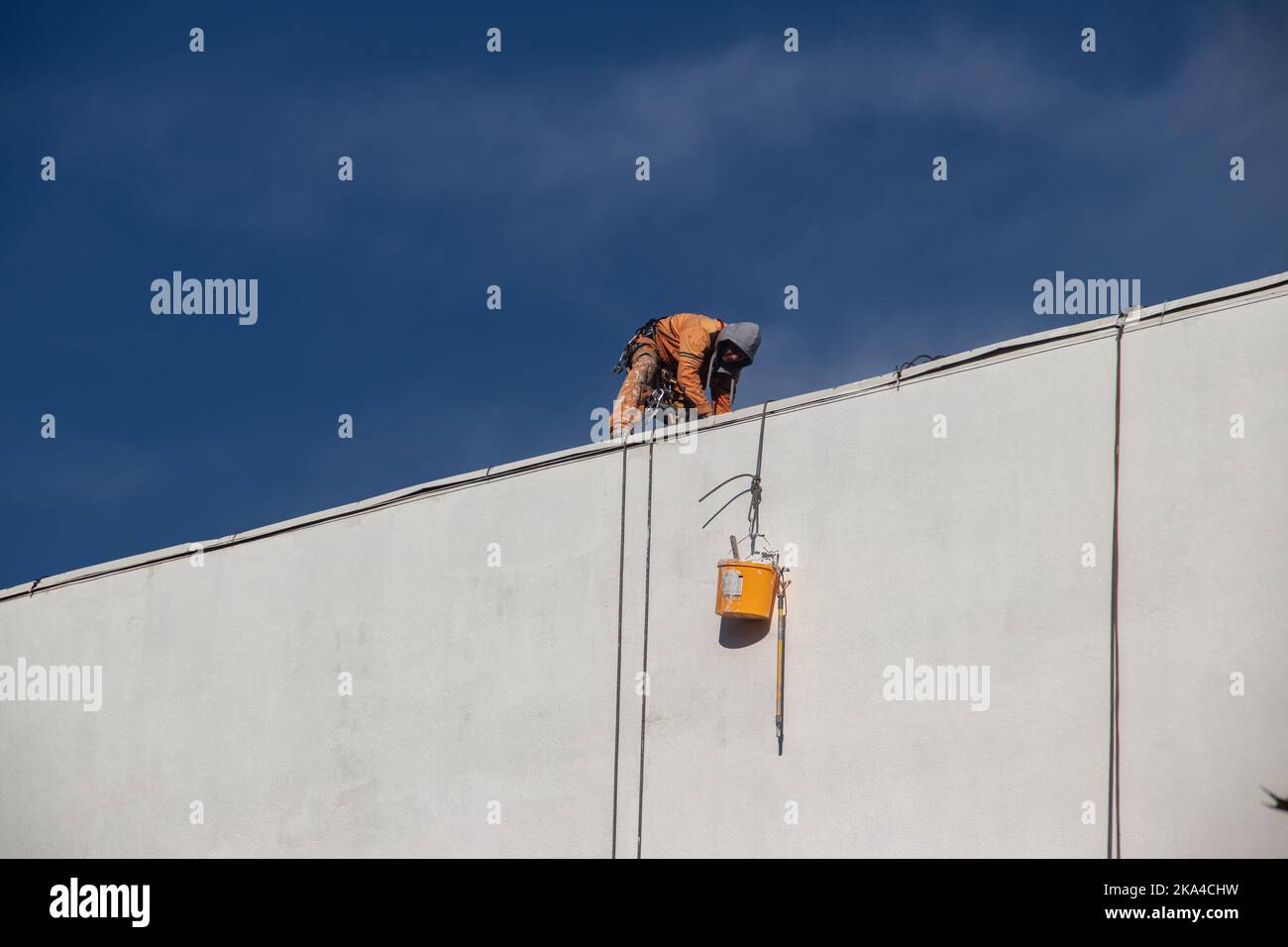 Building construction worker on site, fall prevention body restraint ...