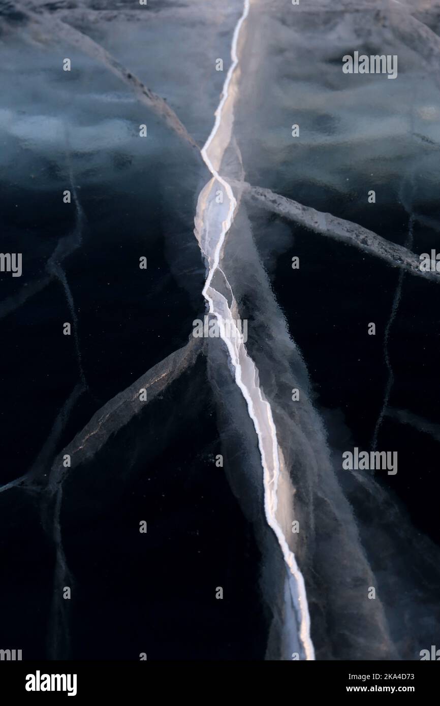A frozen ice crack background Stock Photo - Alamy
