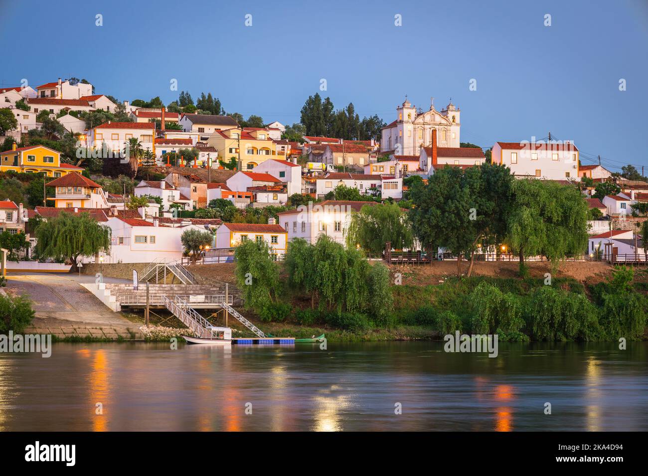 A town on the bay of a river in the evening Stock Photo - Alamy