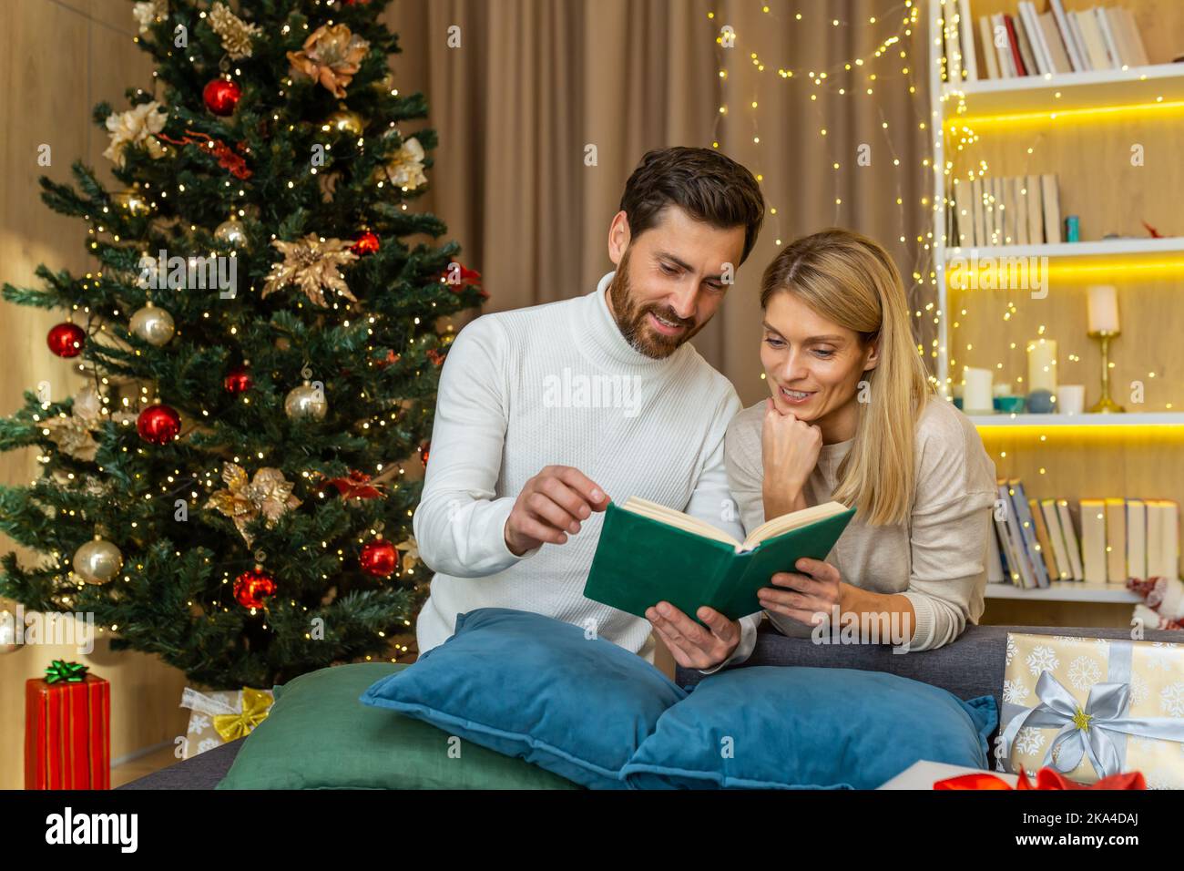 Reading near christmas tree hi-res stock photography and images - Alamy