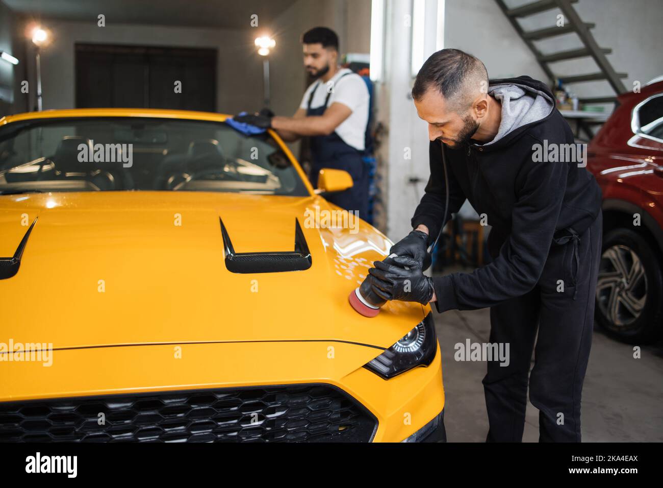 Team of young bearded men, workers of auto detailing service. Males ...