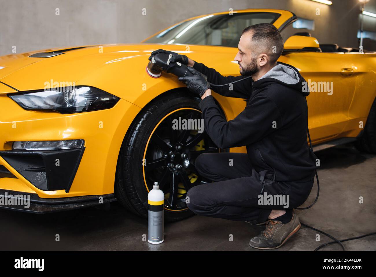 Car detailing and polishing concept. Professional Caucasian male car ...