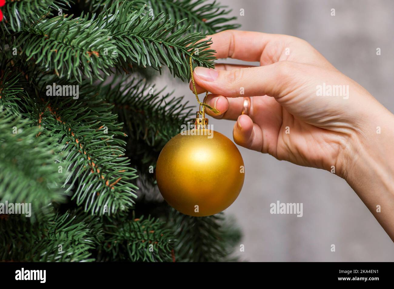 Womans hand decorating xmas tree hi-res stock photography and images ...