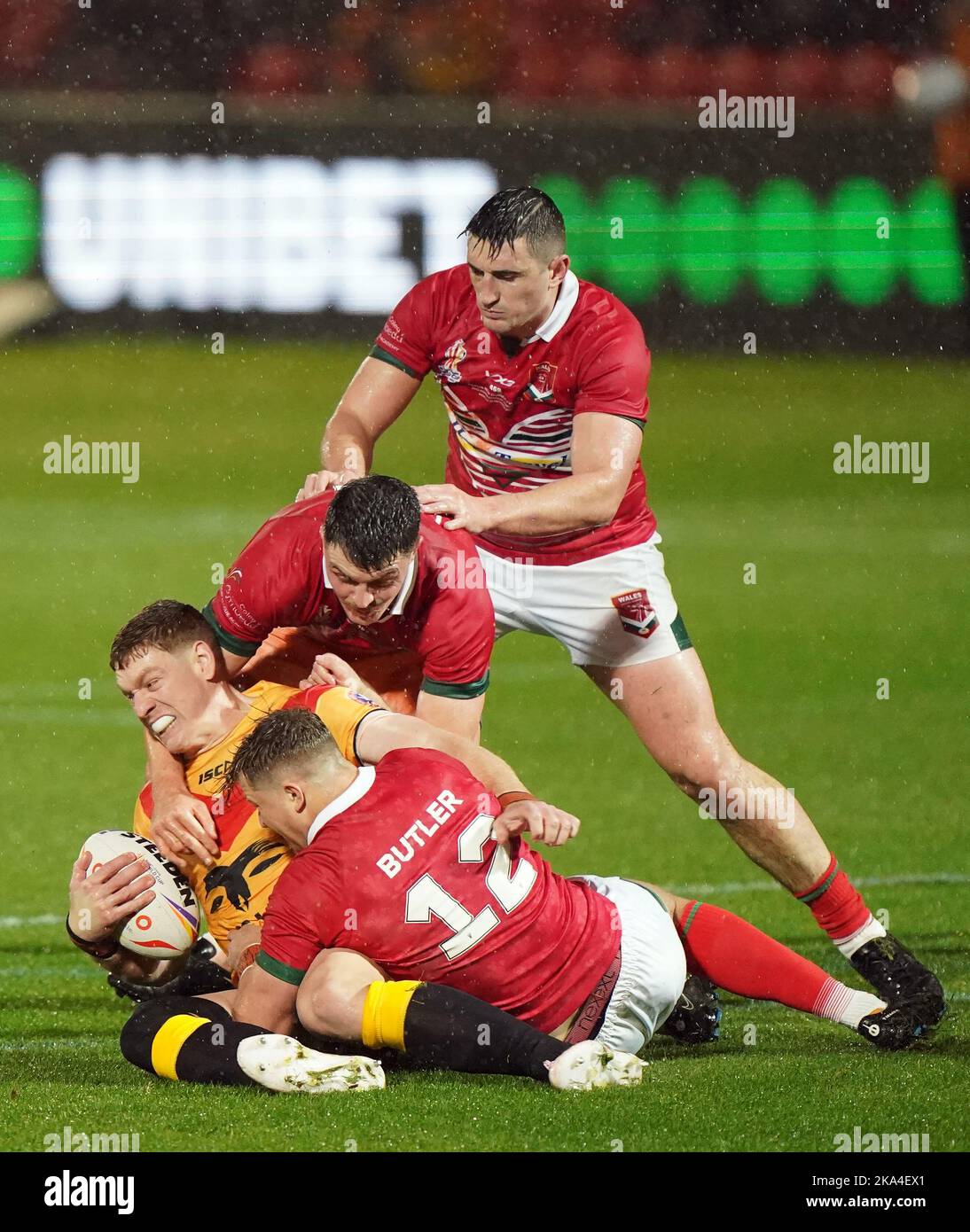 Papua New Guinea's Dan Russell tackled by Wales' Chester Butler during ...